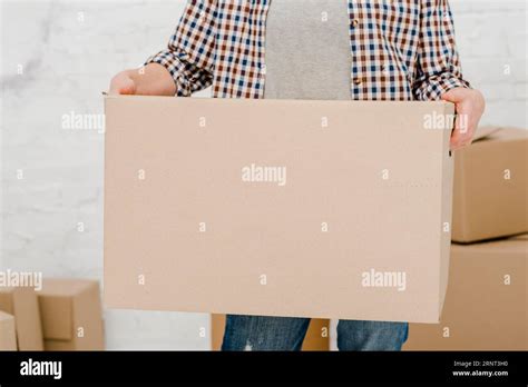 Crop Woman Holding Box Stock Photo Alamy