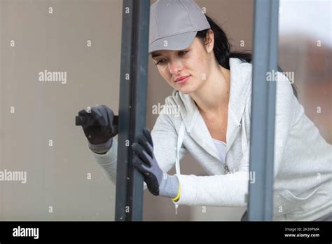 Woman Installing Window Handle With Screwdriver Stock Photo Alamy