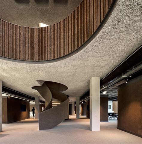 Promontorio Adds Spiral Concrete Staircase To 1980s Office Building In