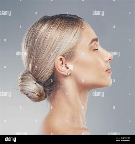 Beauty Profile And Face Of Woman With Eyes Closed On Gray Studio
