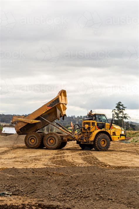 Image Of Dump Truck Working On Infrastructure Construction Site