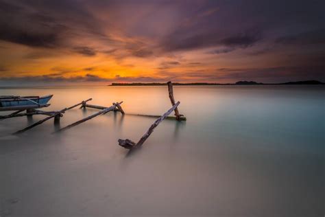 Premium Photo Sunset Of Subtle Colors Over The Shipyard Or Boat On The Coast Of Mentawai
