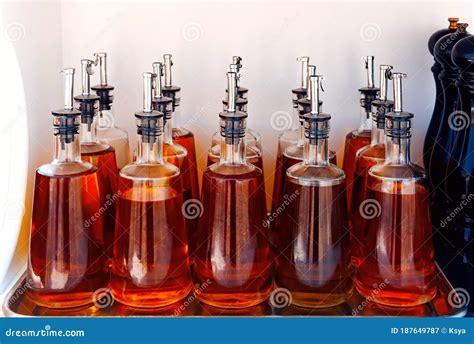 Stack Of Oil Bottles On A Tray Stock Image Image Of Arrangement