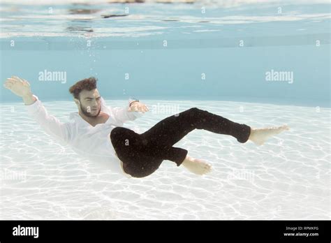 person floating underwater
