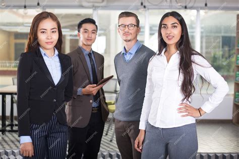 Free Photo Confident Young Business Team Of Four People