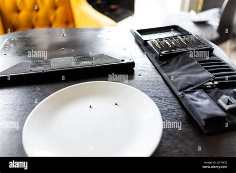 Screws From Unscrewing Laptop Computer Removing Lid Cover For Replacing Dead Hard Solid State