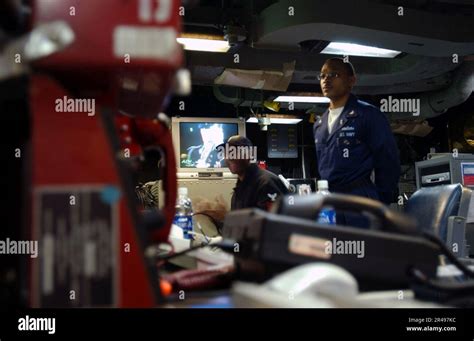 Us Navy An Operations Specialist 1st Class Left Conducts A Briefing