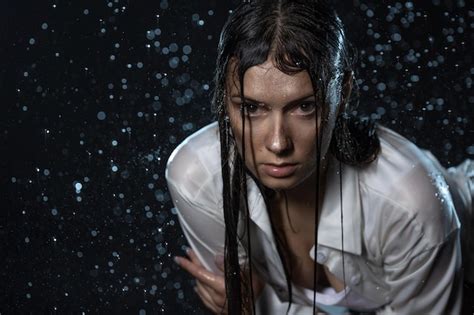 Premium Photo Young Woman In The Rain Getting Wet Through Wet Clothes