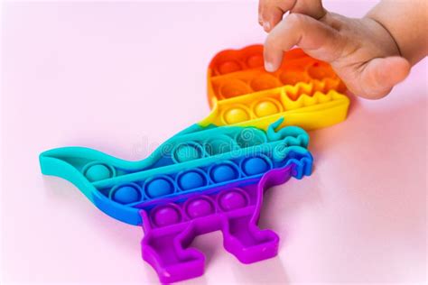 Popit Rainbow Toy In Rainbow Colours And Dino Shape Trendy Bubble Pop