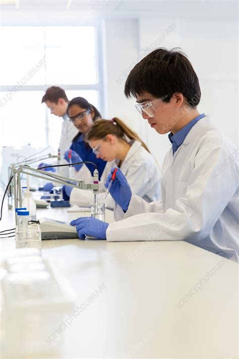 Chemistry Students Using Digital Ph Meters Stock Image C0369007