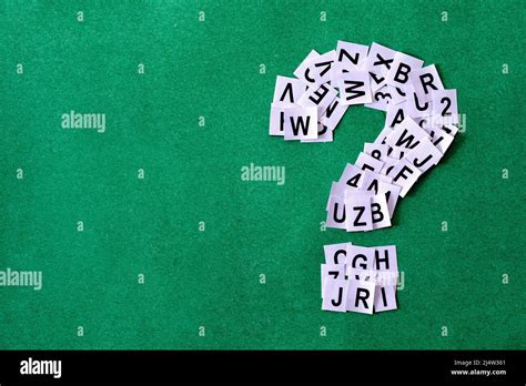 Question Mark On Green Background With Copy Space Made Of Paper With Letters And Numbers Minimal