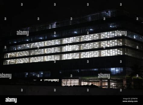 Building Or Workspace With Full Of Lights Illuminated During The Night