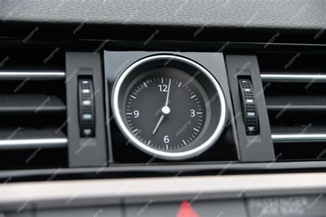 Premium Photo Analog Clock On The Dashboard Of The Car