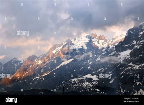 Dramatic Clouds And Light At The Sunrise Time Over The Alps Peaks Klein