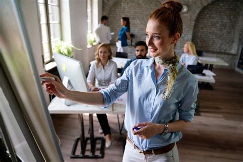 Female Chief Analyst Holds Meeting Presentation For A Business Team Of Economists Work In