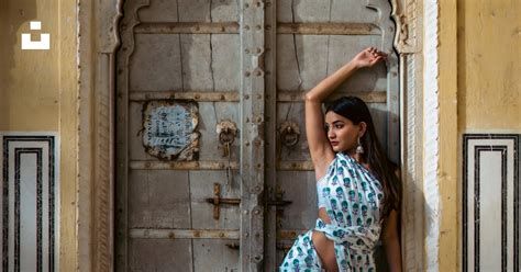A Woman Standing In Front Of A Door Photo Free Sexy Image On Unsplash