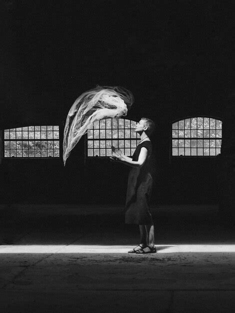 Premium Photo Woman Standing Against Window