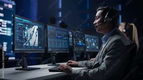 Confident Male Cyber Security Data Scientist Works On Personal Computer