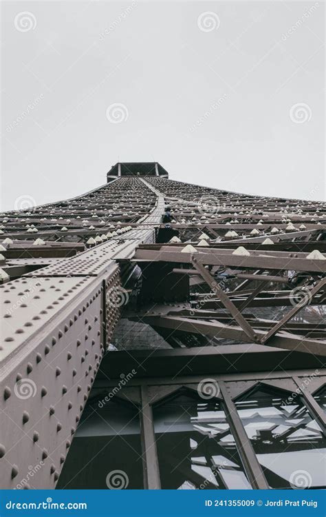 A Massive Structure Being Built With Scaffolding And A Crane Constructing Building Of A