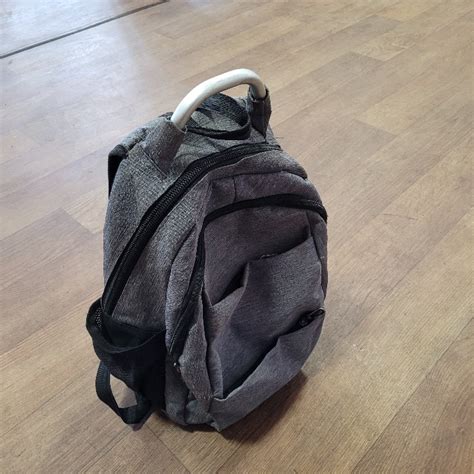 Рюкзак тряпчаний сірого кольору з написом «white б в та 2 цепки для бензопили б в Ua