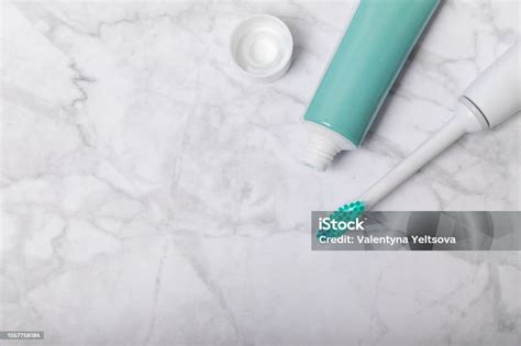 Bathroom With Sonic Electric Toothbrush Toothpaste Mouthwash Dental Floss And Tongue Cleaner