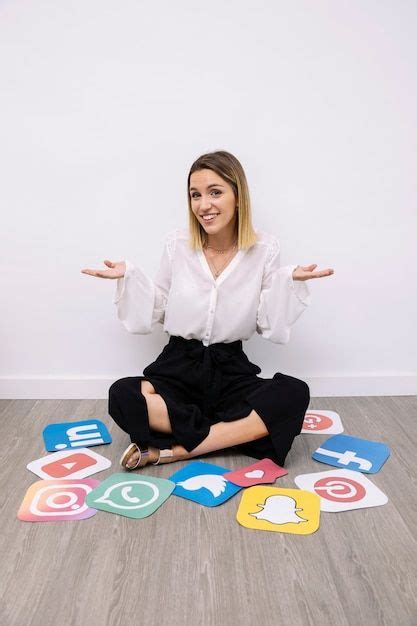 Free Photo Portrait Of Businesswoman Sitting With Social Media Icons Gesturing Social Media