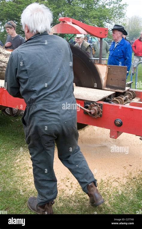 Men Demonstrating Cutting Wood Tractor Hi Res Stock Photography And