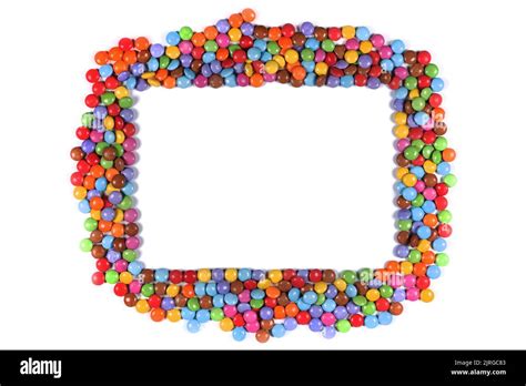 Frame Border Of Multi Coloured Halloween Candy Sweets On White Stock