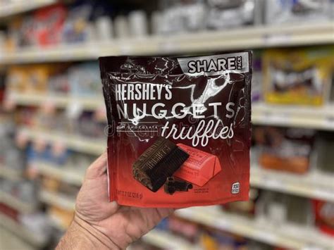 Retail Store Candy Hand Holding Hershey Nuggets Dark Cherry Editorial