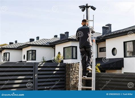 Urban Homes Safety Installing Cameras On Metal Pole For Surveillance