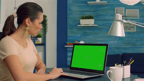 Business Woman Working At Online Coomunication Project Using Laptop Computer With Mock Up Green