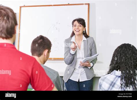 Teacher Points A Babe With Her Finger At A High Babe Class Stock Photo Alamy