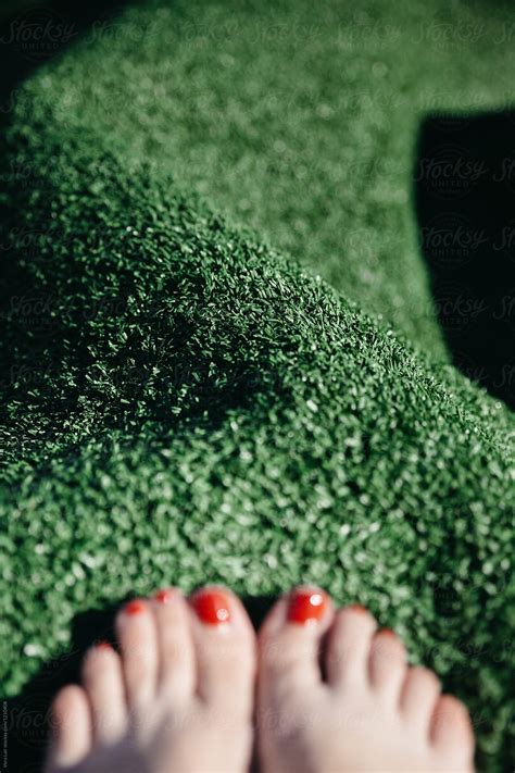 Woman Feet And Fake Grass By Stocksy Contributor Vera Lair Stocksy