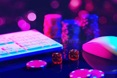 Red Dice On A Pink Surface With A Computer Keyboard And Mouse Stock