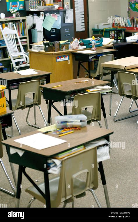 Empty Elementary Grade School Classroom With Desks And Chairs Stock
