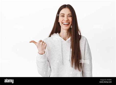 Image Of Joyful Girl Inviting To Take Look Pointing That Way Showing