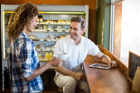 Couple interacting with each other in café Stock-Foto | Adobe Stock