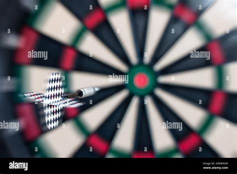 Blurred Motion Image Of A Dart Flying Towards The Bull S Eye Of A Target Playing Concept Stock