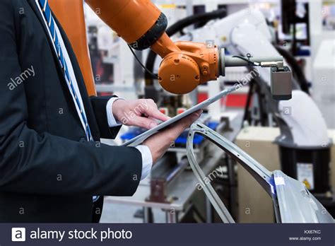 Engineer Hand Using Tablet With Machine Real Time Monitoring System Software Automation Robot