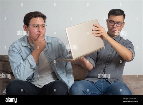 Gay Couple With Laptop Online Communication Technology Problems Education Stock Photo Alamy