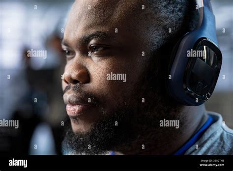 Admin In Data Center Wearing Headphones Coordinating Deployment Of