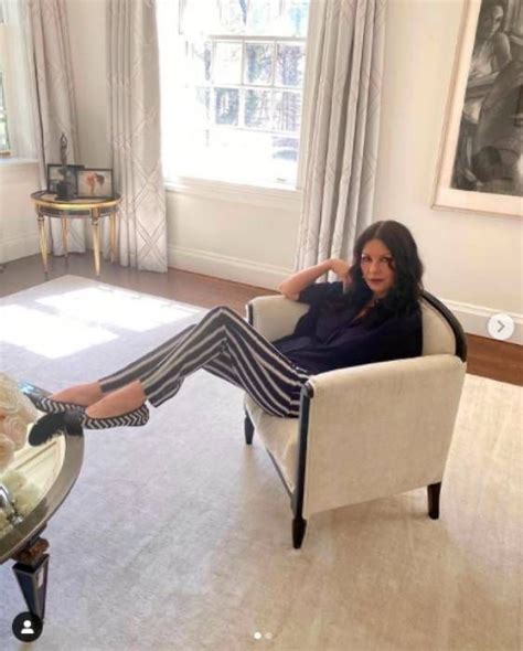 Catherine Zeta Jones Looks Sensational In Purple Swimsuit As She Swims