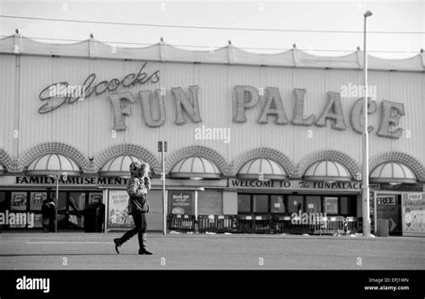 Blackpool Lancashire Uk Woman Walks Past The Deserted Silcocks Fun Palace On Cold Winters Day
