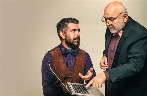 Adult Son And Old Father Using Computer Surfing Internet Together Younger Generation Caring