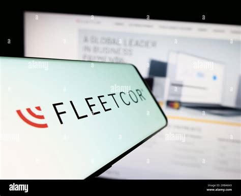 Smartphone With Logo Of Us Financial Company Fleetcor Technologies Inc On Screen In Front Of
