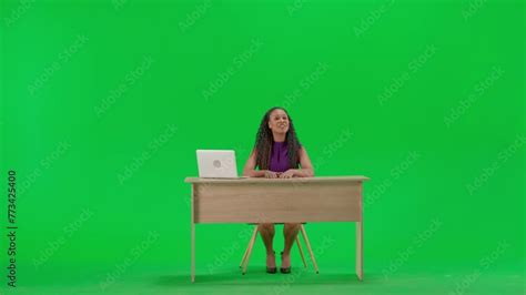 Female In Dress Sit At The Desk Isolated On Chroma Key Green Screen