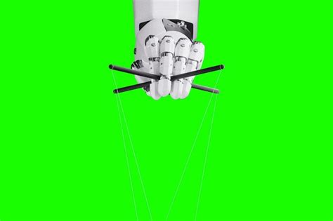 premium photo in the robot hand a means to control humanity as