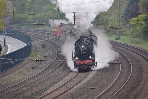 Premium Photo Train Passing Through Railroad Tracks