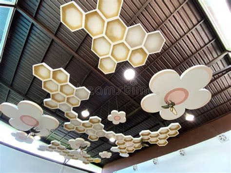 Ceiling Decor Featuring Honeycomb And Flower Shapes In A Modern