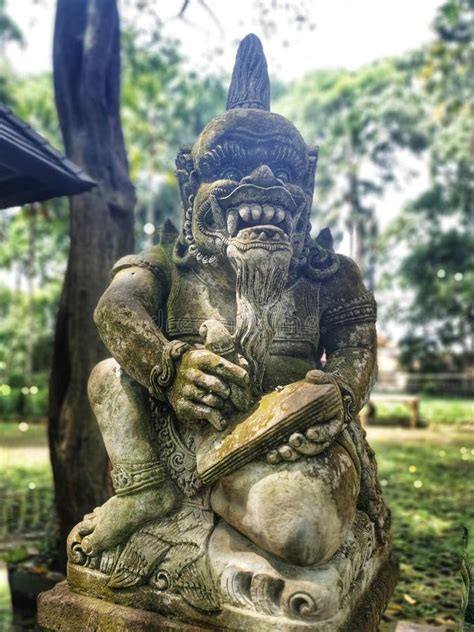 Stone Carved Statue Of An Ancient God From A Balinese Hindu Temple